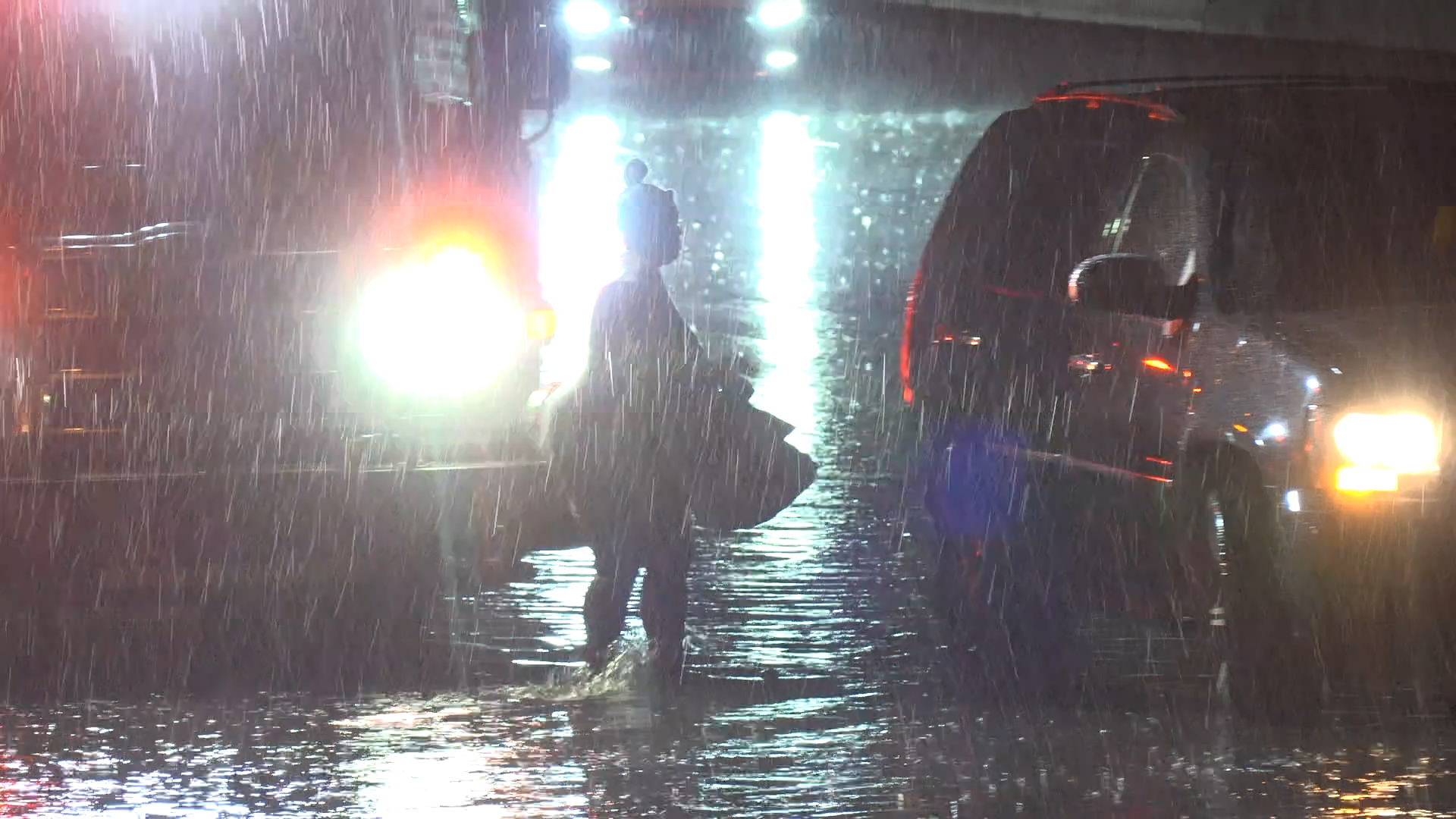 Van gets stuck in high water on the East Freeway near Lockwood ...