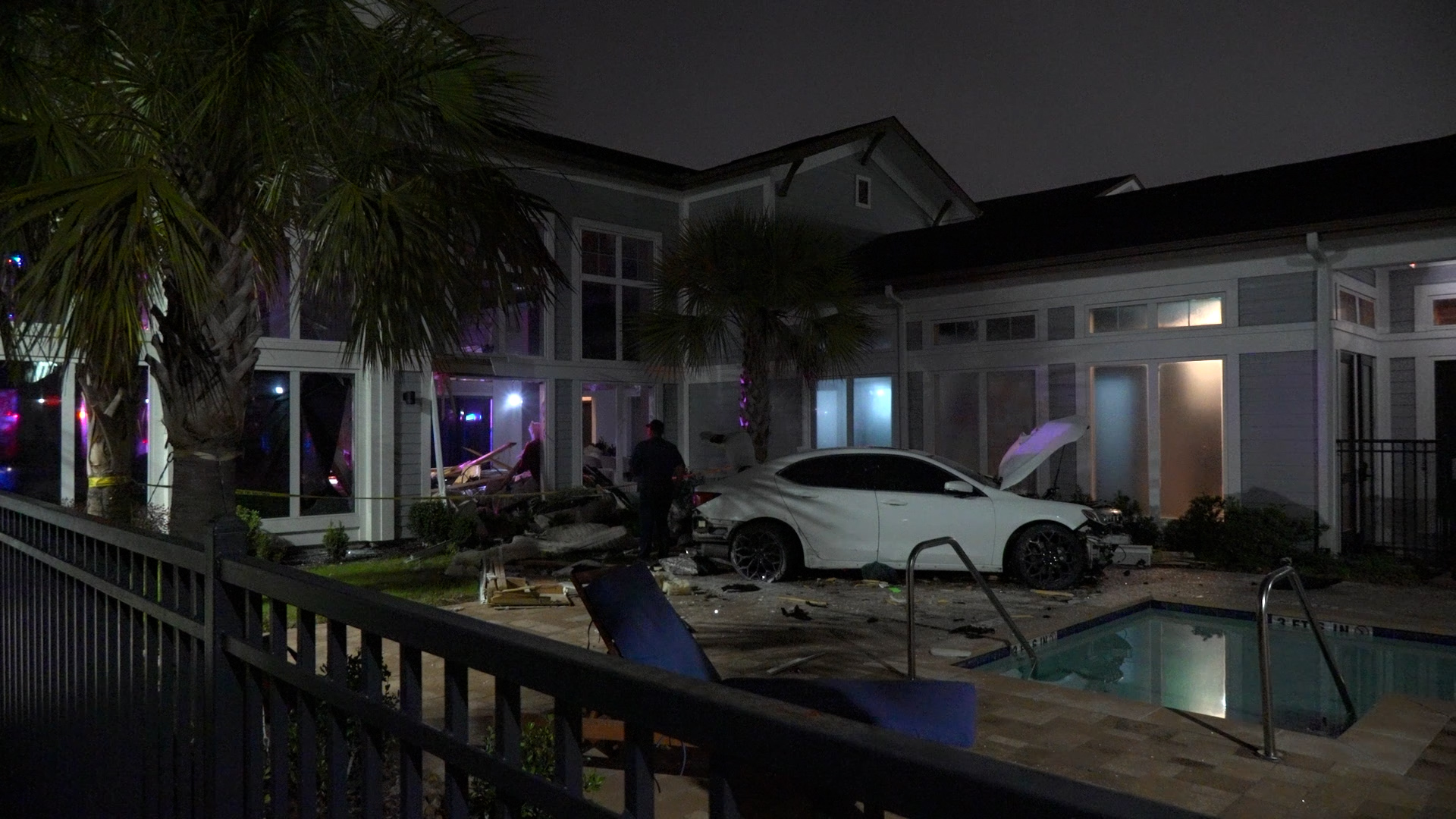 Car crashes through leasing office at Evolve Champions Apartments, ends ...