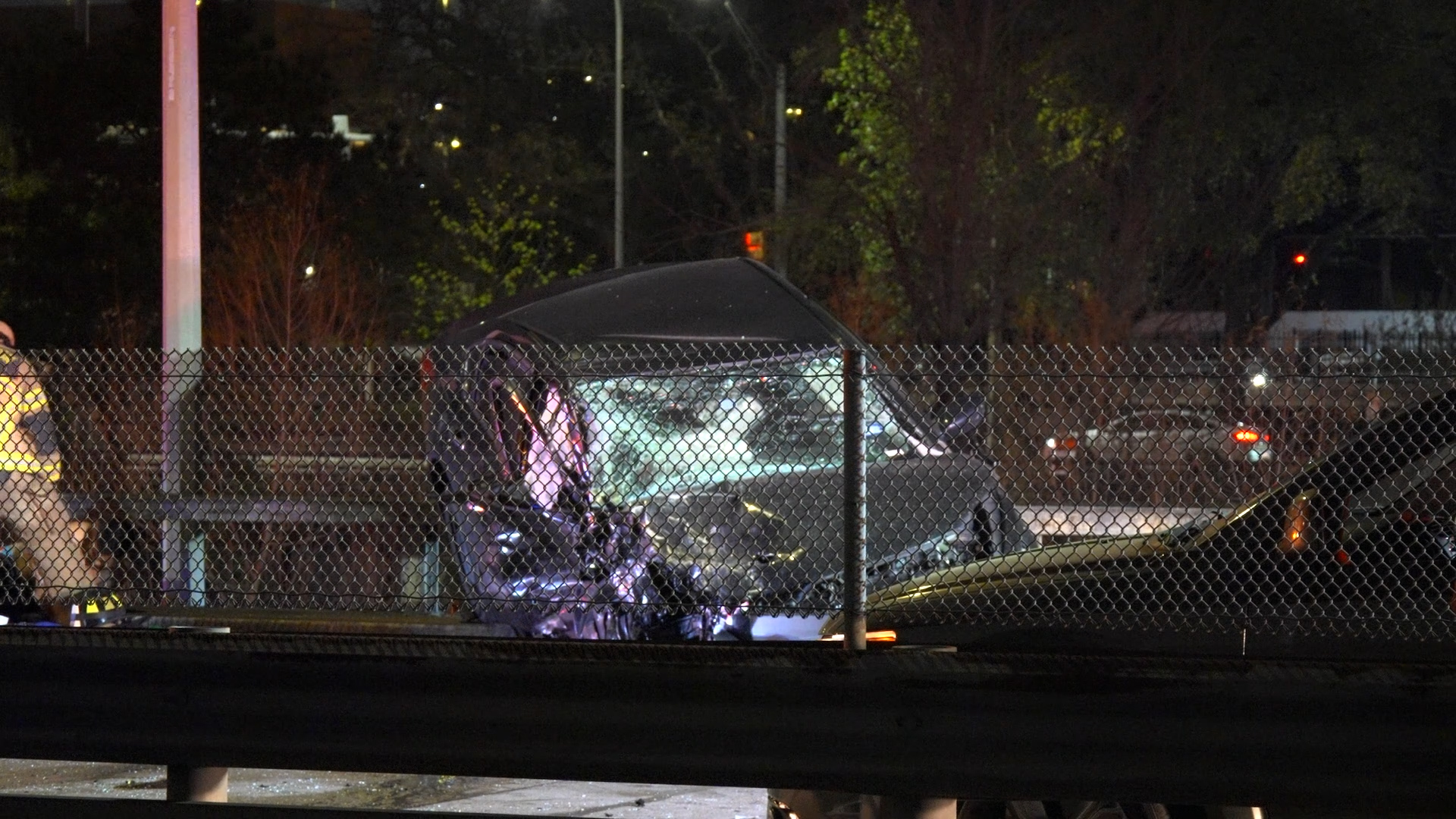 Car becomes lodged on guardrail after major crash on Memorial Drive in ...